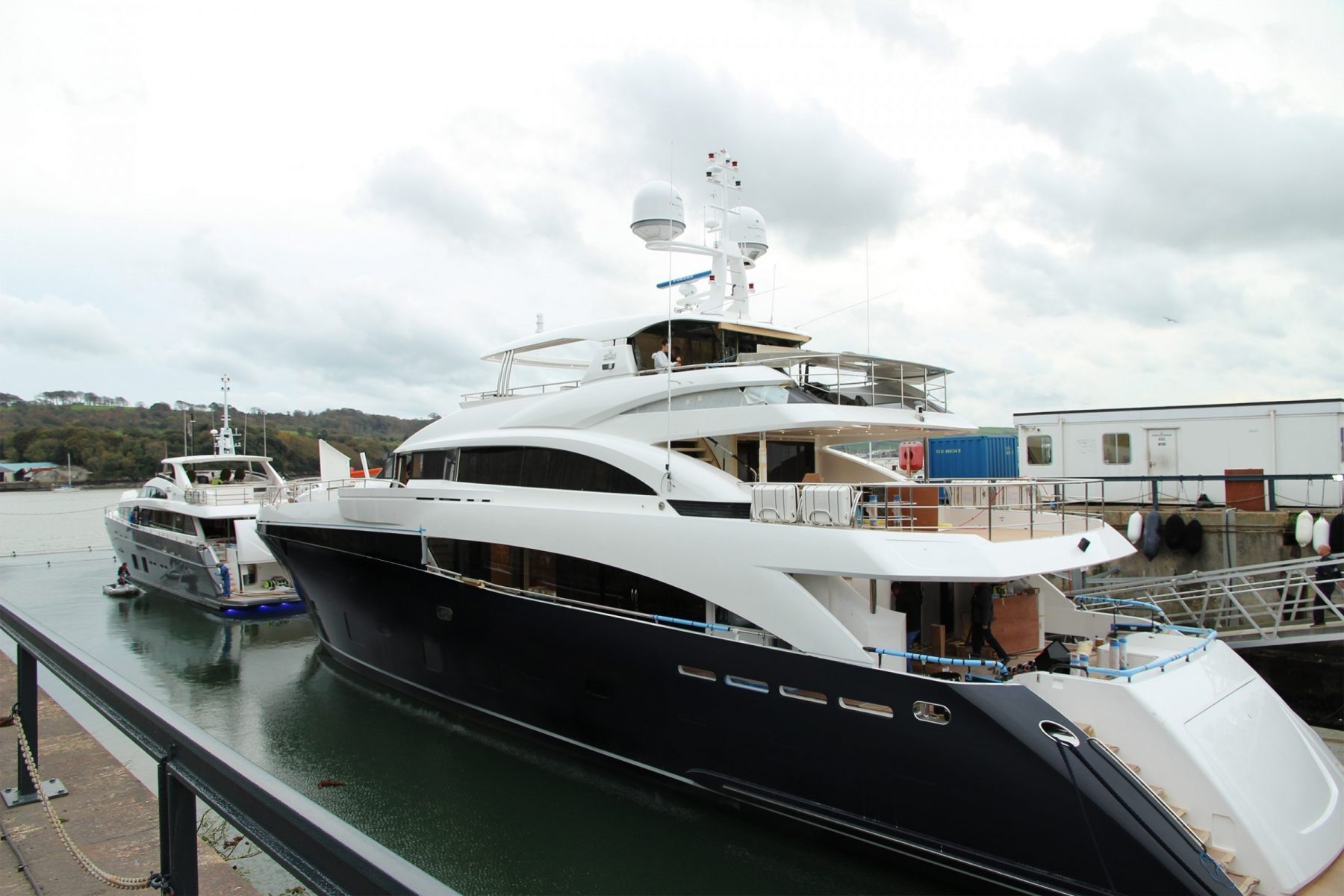 Two M-Class Luxury Princess Motor Yachts Lying in Shallow Dock